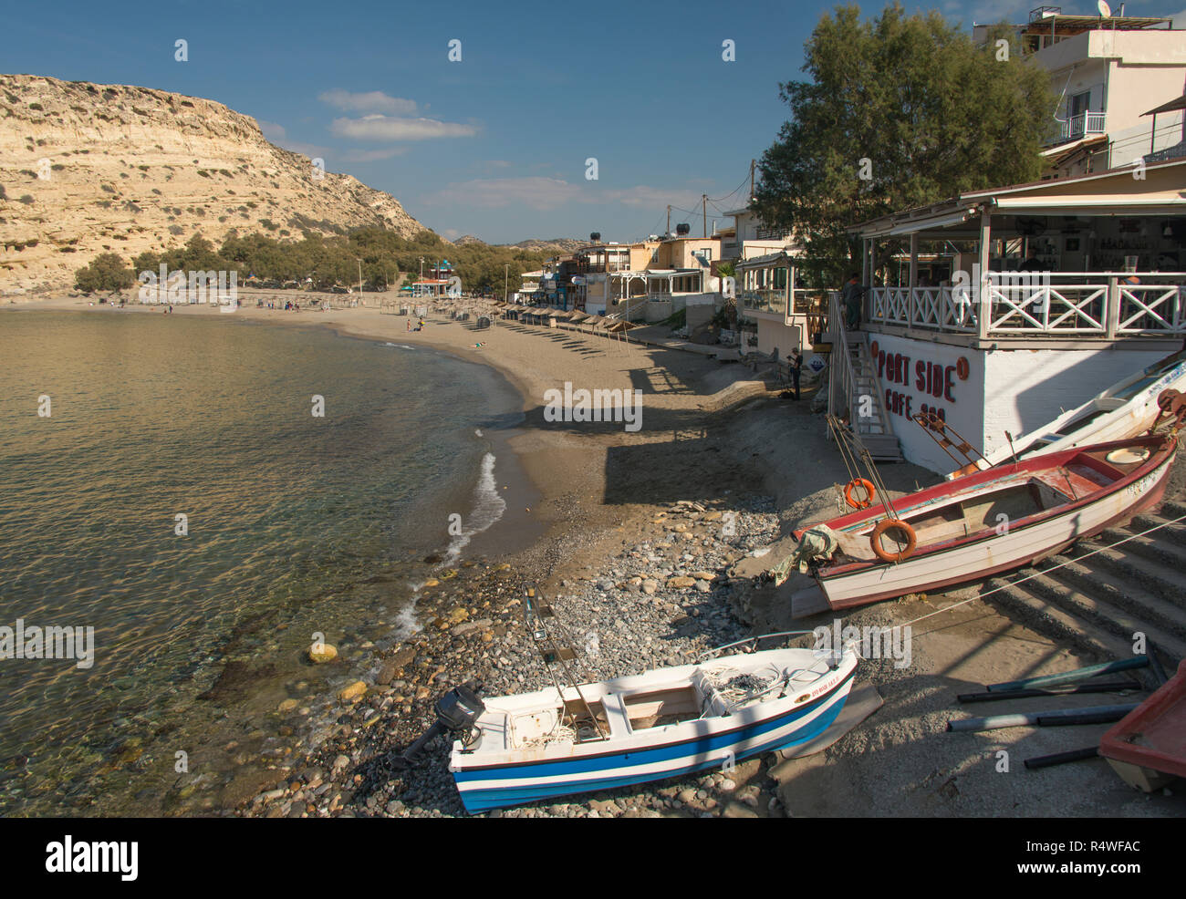 Matala beach, caves, blue sea and sky in Crete Stock Photo - Alamy