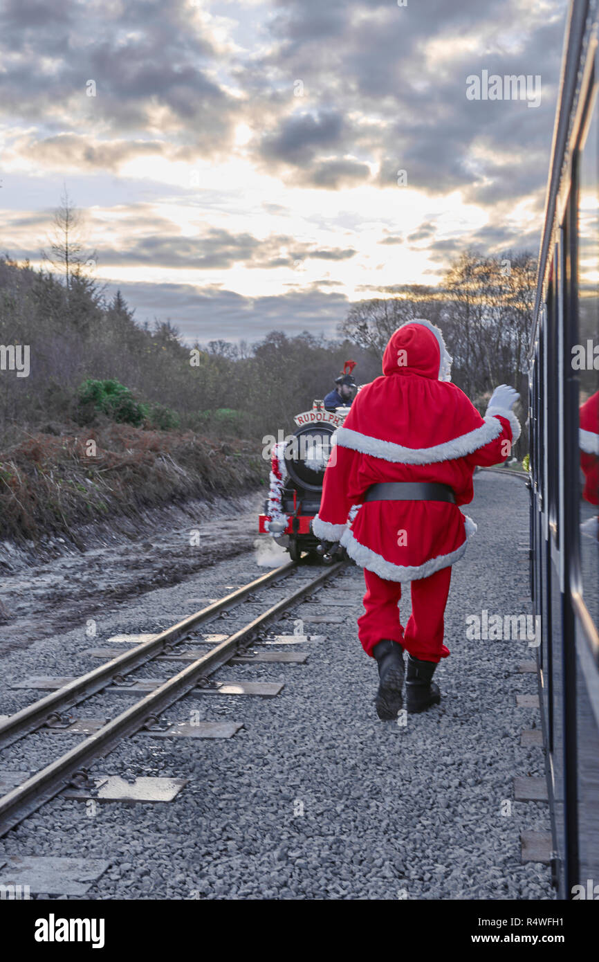 Santa Claus, Father Christmas, waves farewell to a carriage on the ...