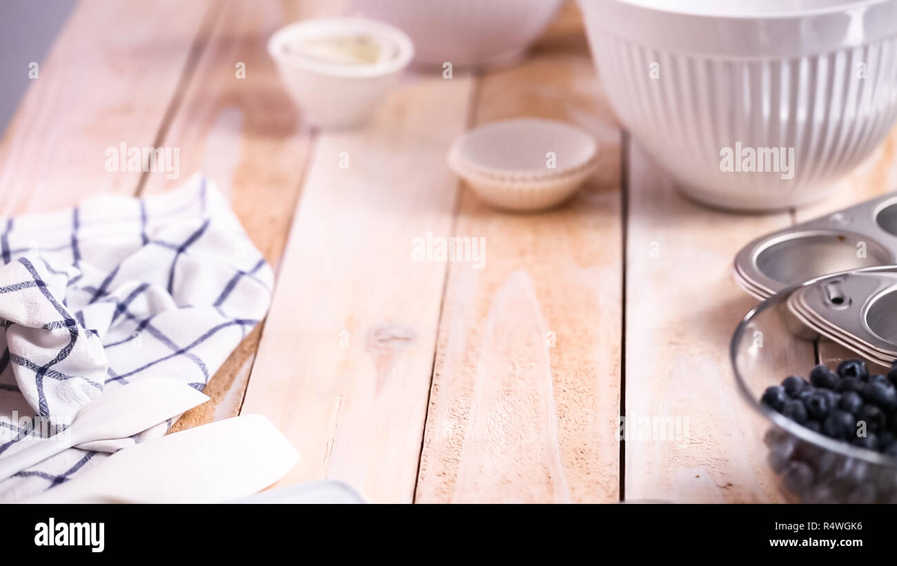 Mixing ingredients together in mixing bowl for blueberry muffins Stock ...