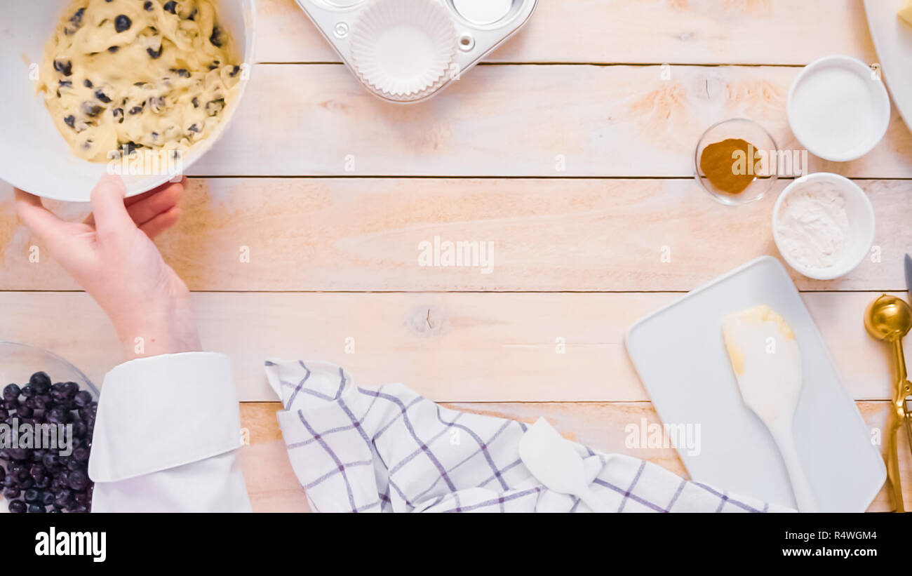 Mixing ingredients together in mixing bowl for blueberry muffins Stock ...