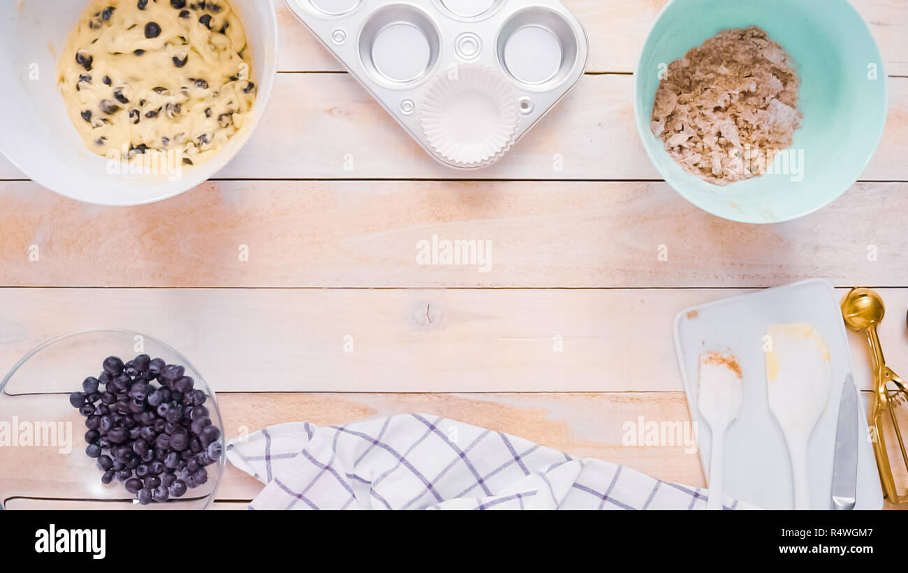 Mixing ingredients together in mixing bowl for blueberry muffins Stock ...