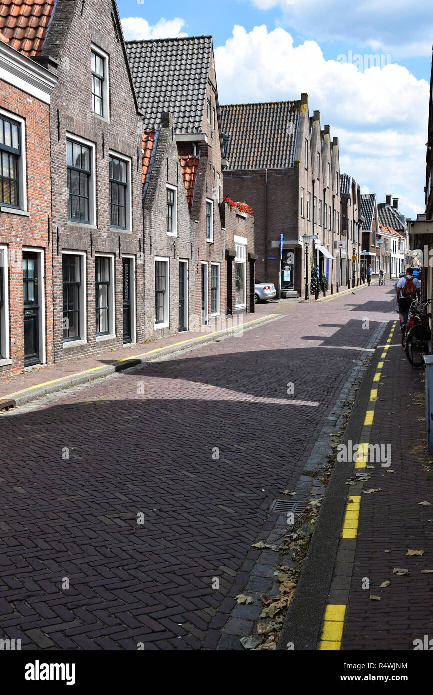 Empty street in the Dutch town Muiden with Muiderslot, Muiden Castle ...