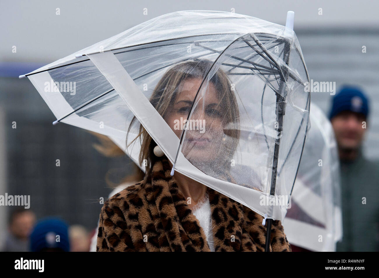 A women with her umbrella in the wind on Westminster Bridge, London as ...