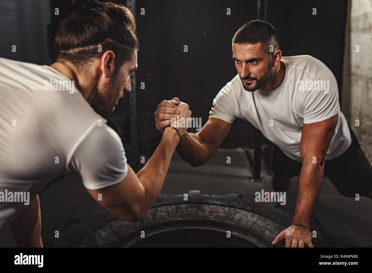 Athlete muscular sportsmen with hands clasped arm wrestling challenge ...