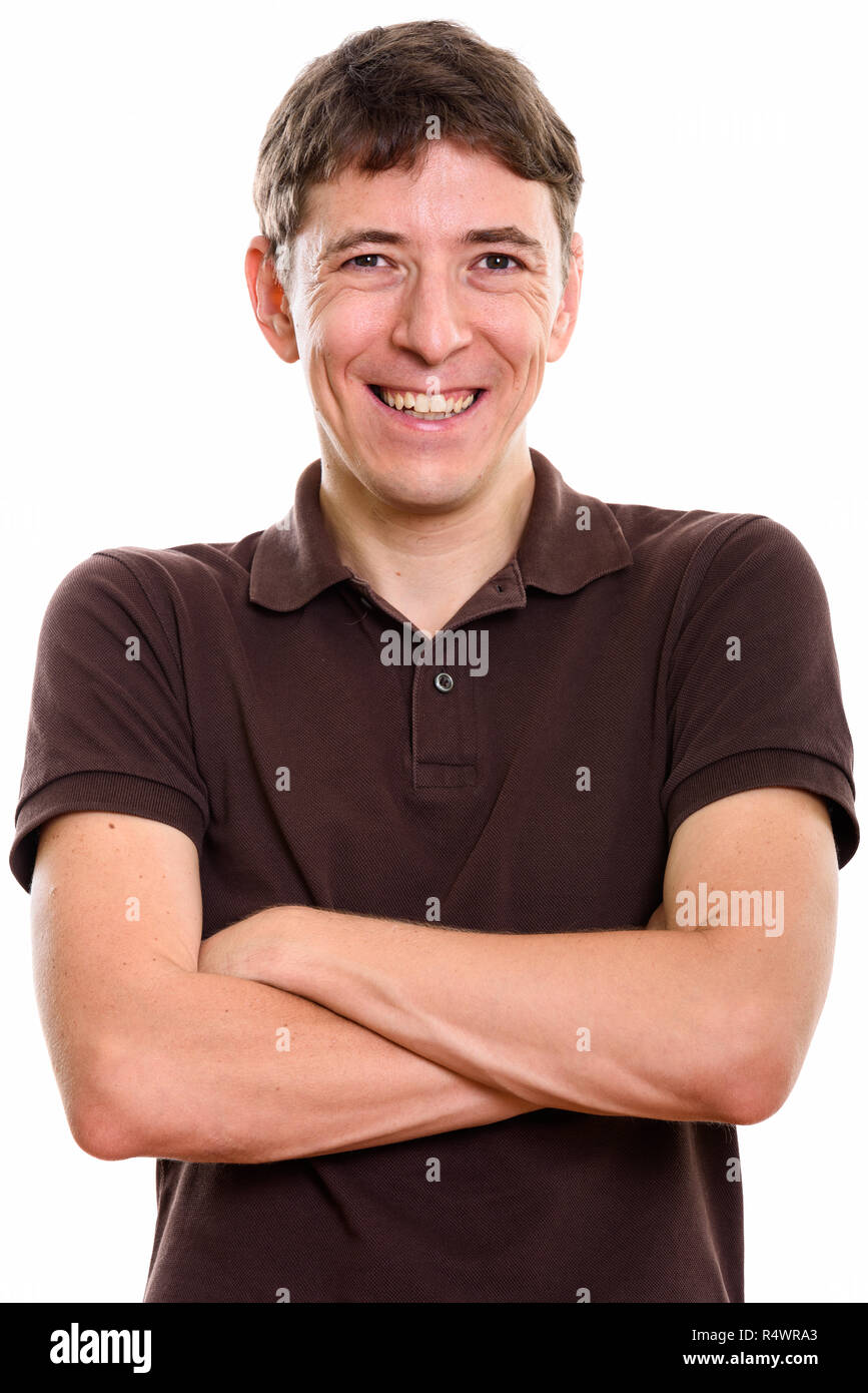 Studio shot of happy man smiling with arms crossed Stock Photo - Alamy