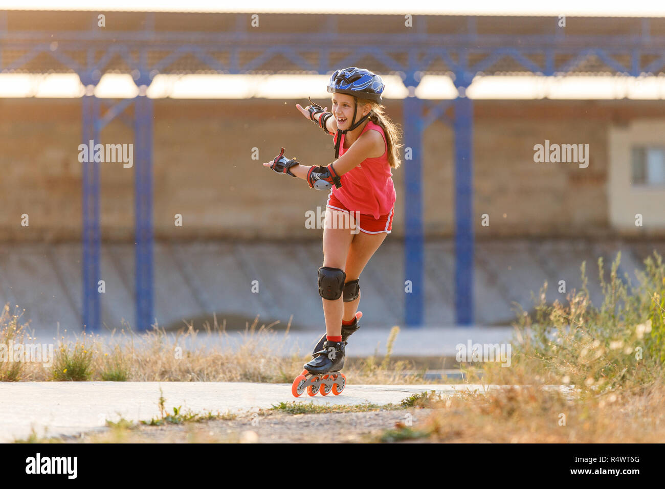 Young teenage girl speed skating on rollerdrome Stock Photo - Alamy