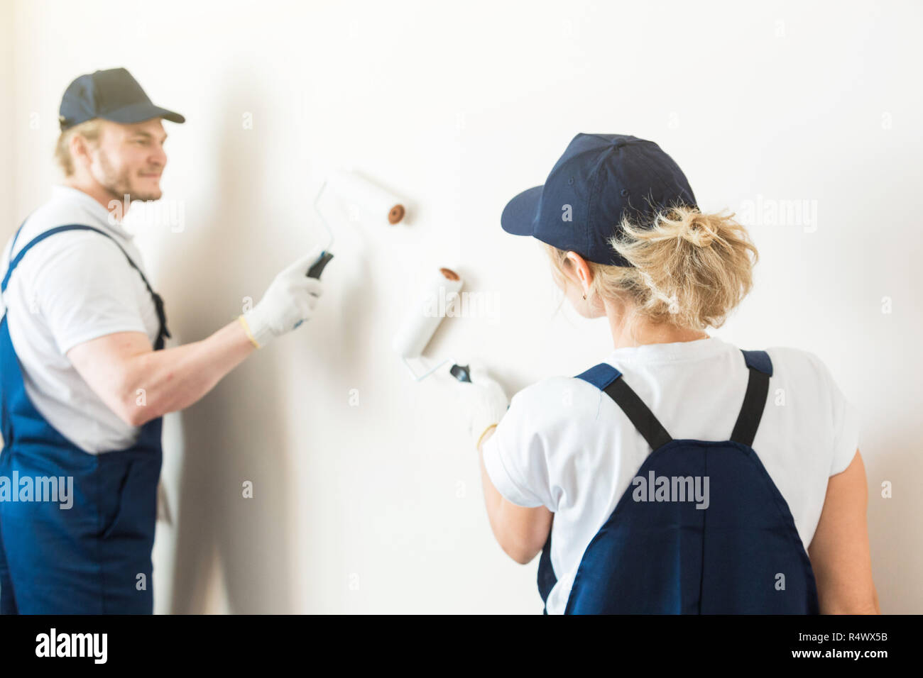 Hand male worker professionally paint hi-res stock photography and ...