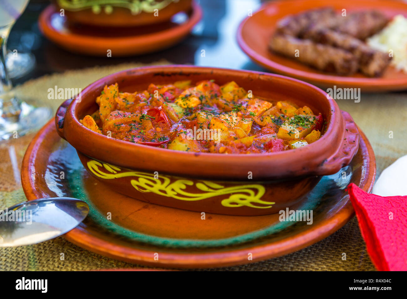 Balkan vegetable stew served in a traditional food clay dish. Zlatibor ...