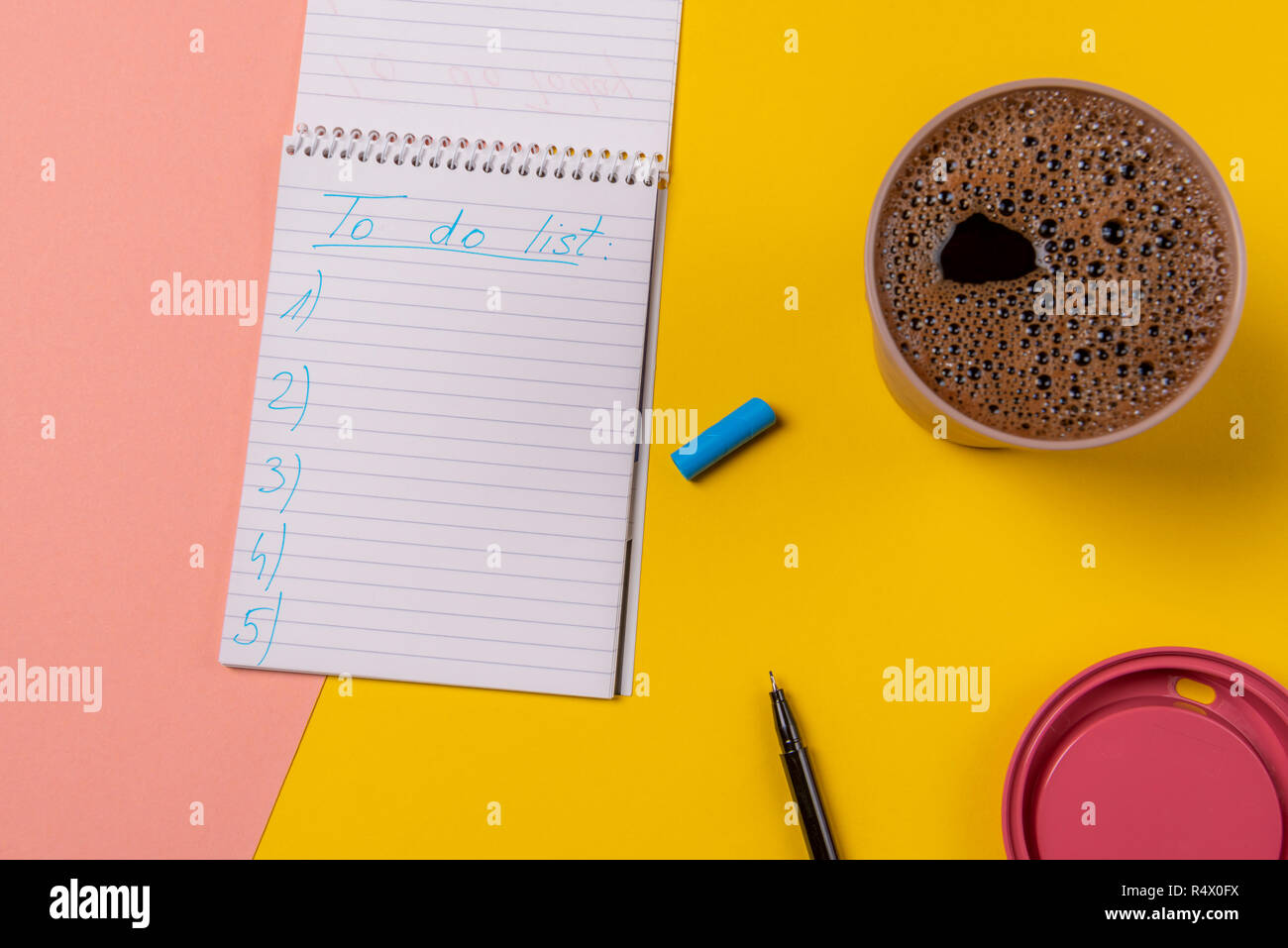 Checklist numbered to five handwritten on an open spiral notebook and ...