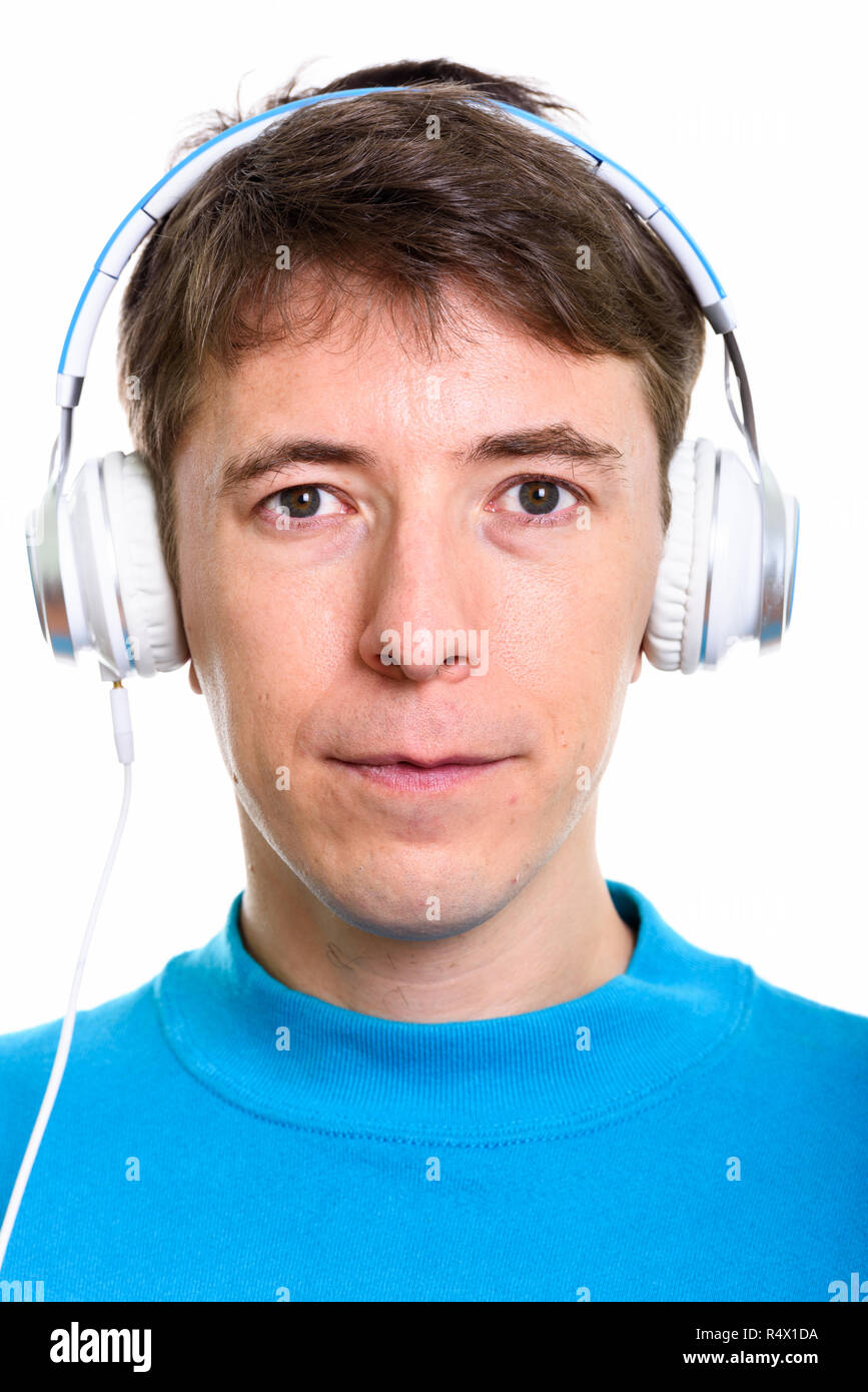 Face of man listening to music with headphones Stock Photo - Alamy