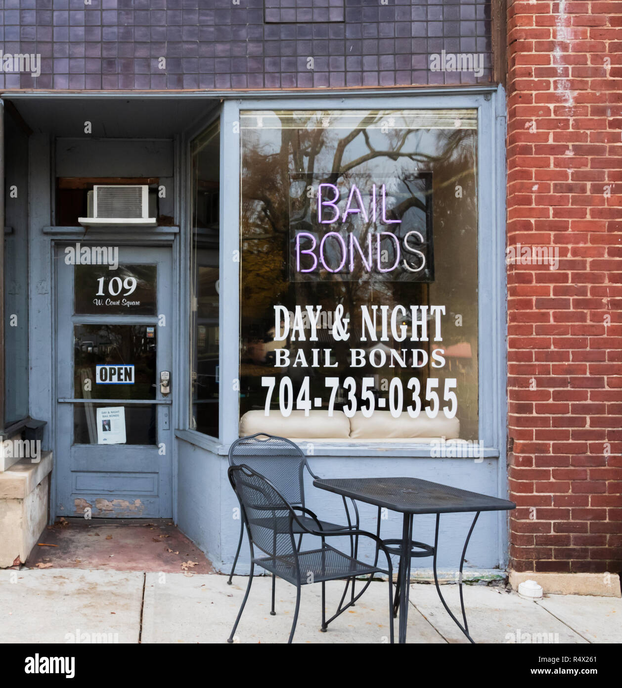 LINCOLNTON, NC, USA-11/25/18: Bail Bonds office with table & chairs in ...