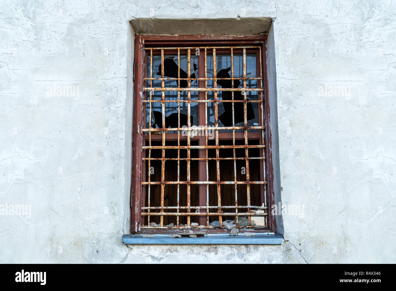 Rusted iron bars and broken glass window Stock Photo - Alamy