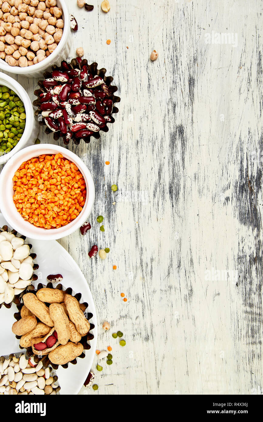 Bowls of various legumes red turkish lentils, chickpeas, beans, peanuts ...