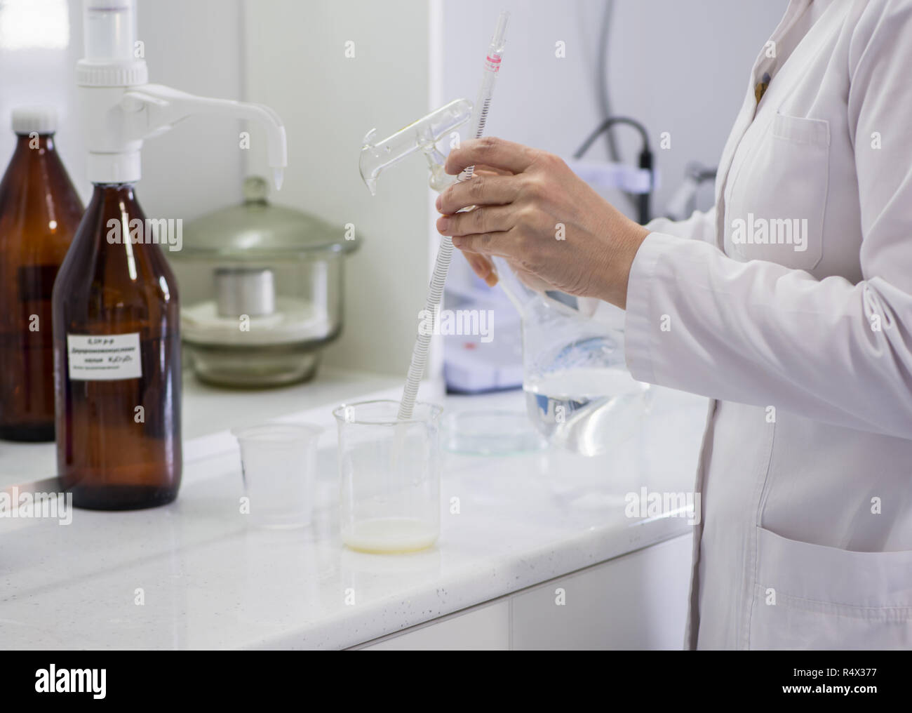 woman testing samples of dairy products in the laboratory. test ...