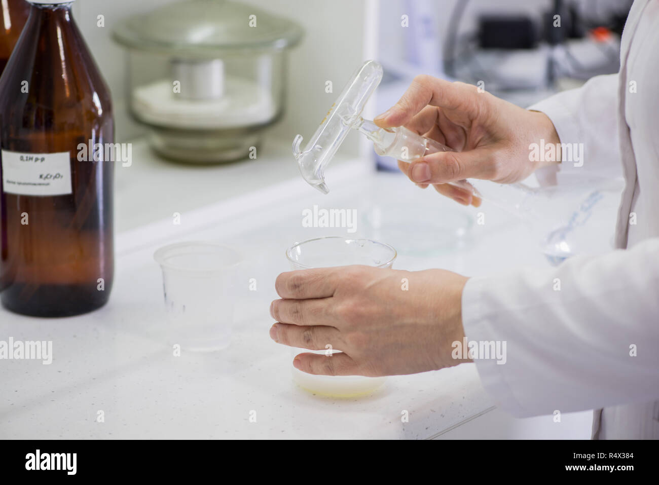 woman testing samples of dairy products in the laboratory. test ...