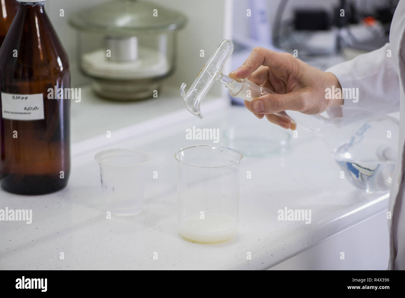 woman testing samples of dairy products in the laboratory. test ...