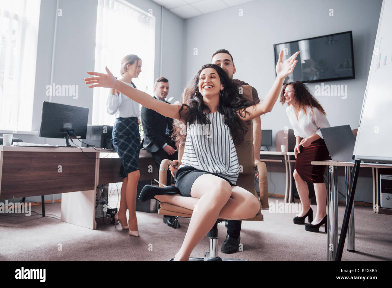 Happy young colleagues smile and have fun at the creative office Stock ...