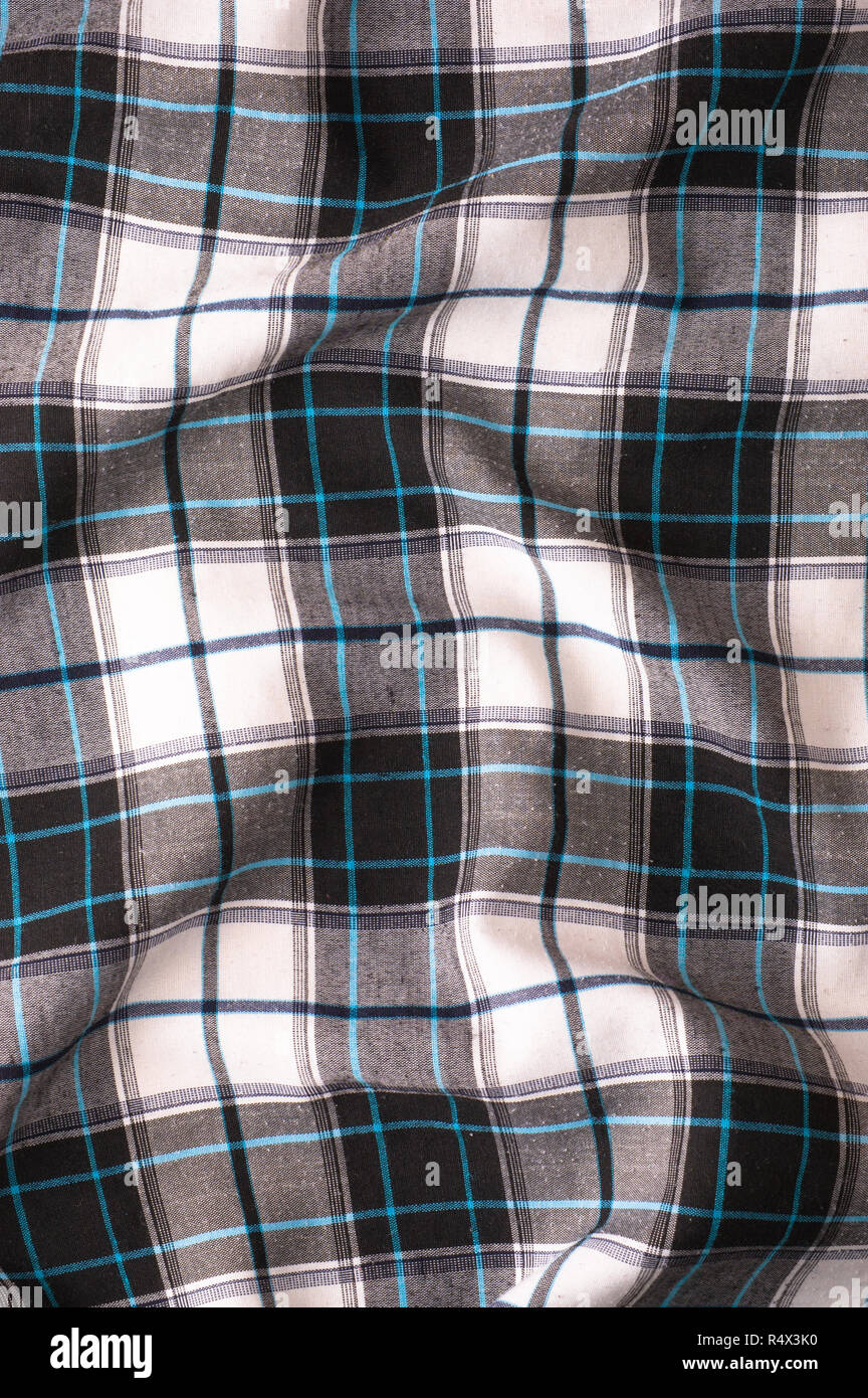 White-black textile texture of the checkered shirt useful as background ...