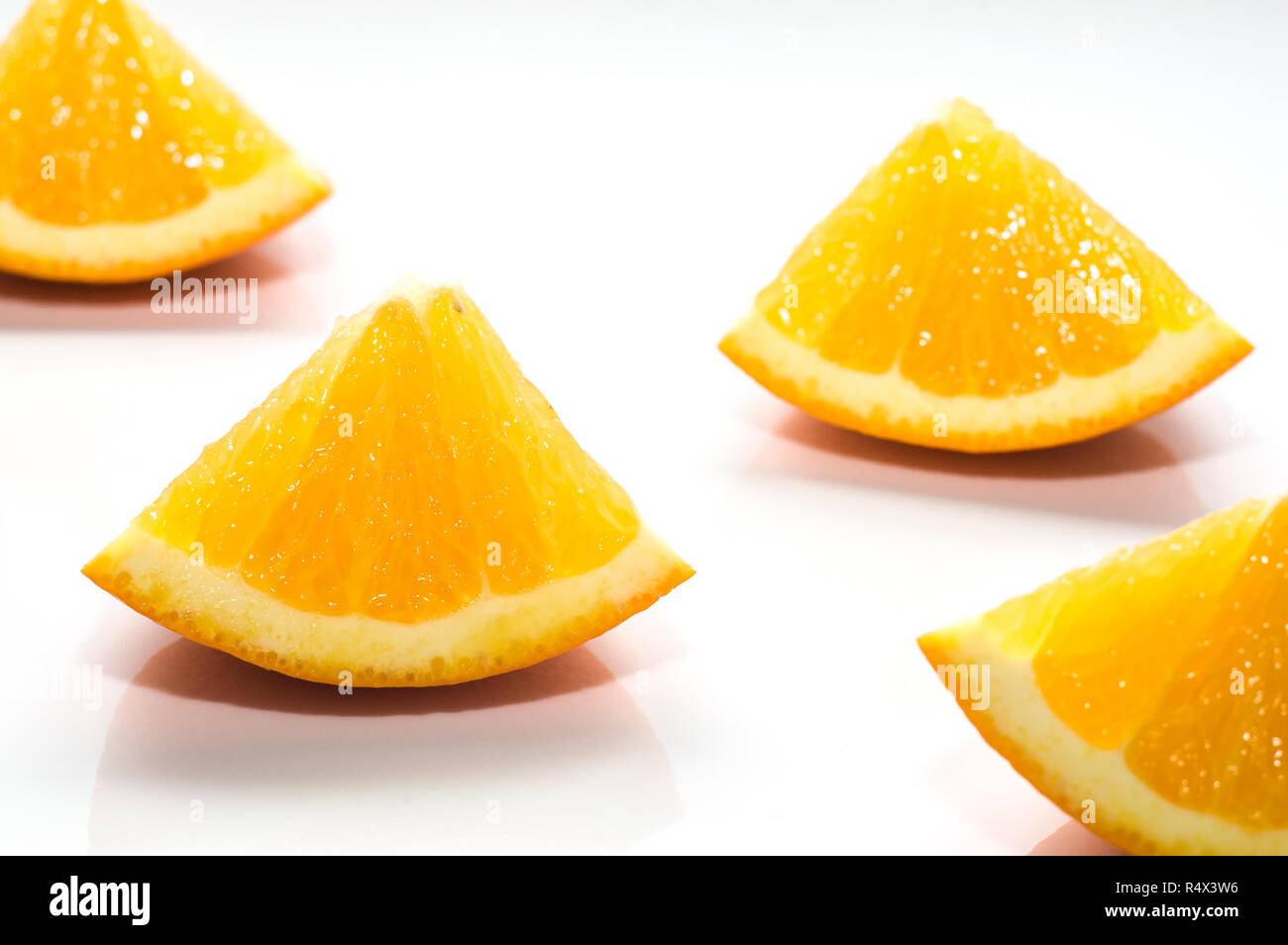 Pieces of orange fruit isolated on white background Stock Photo - Alamy