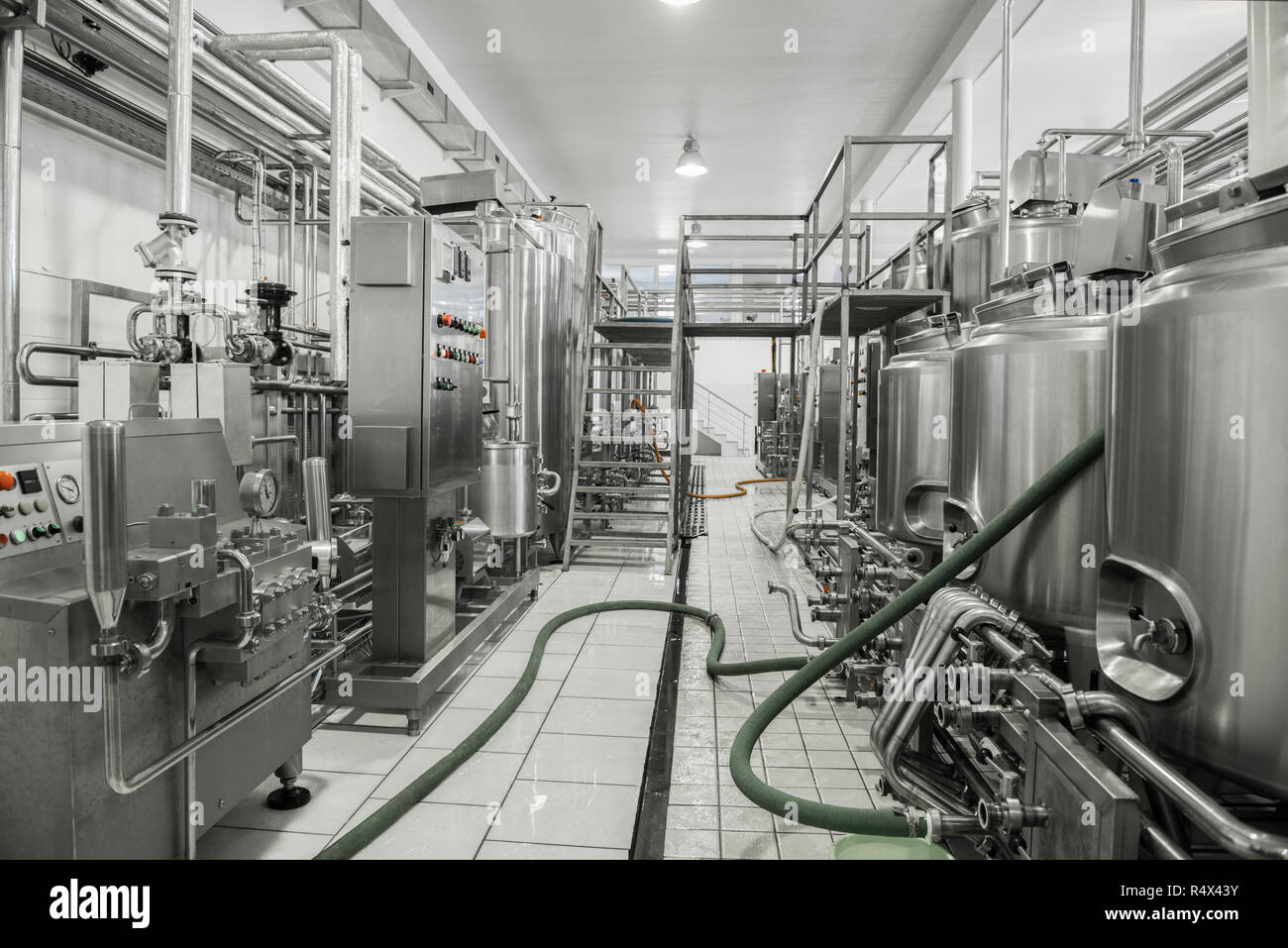 general view of the interior of a milk factory. equipment at the dairy ...