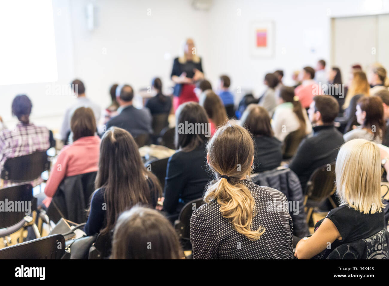 Woman giving presentation on business conference workshop Stock Photo ...