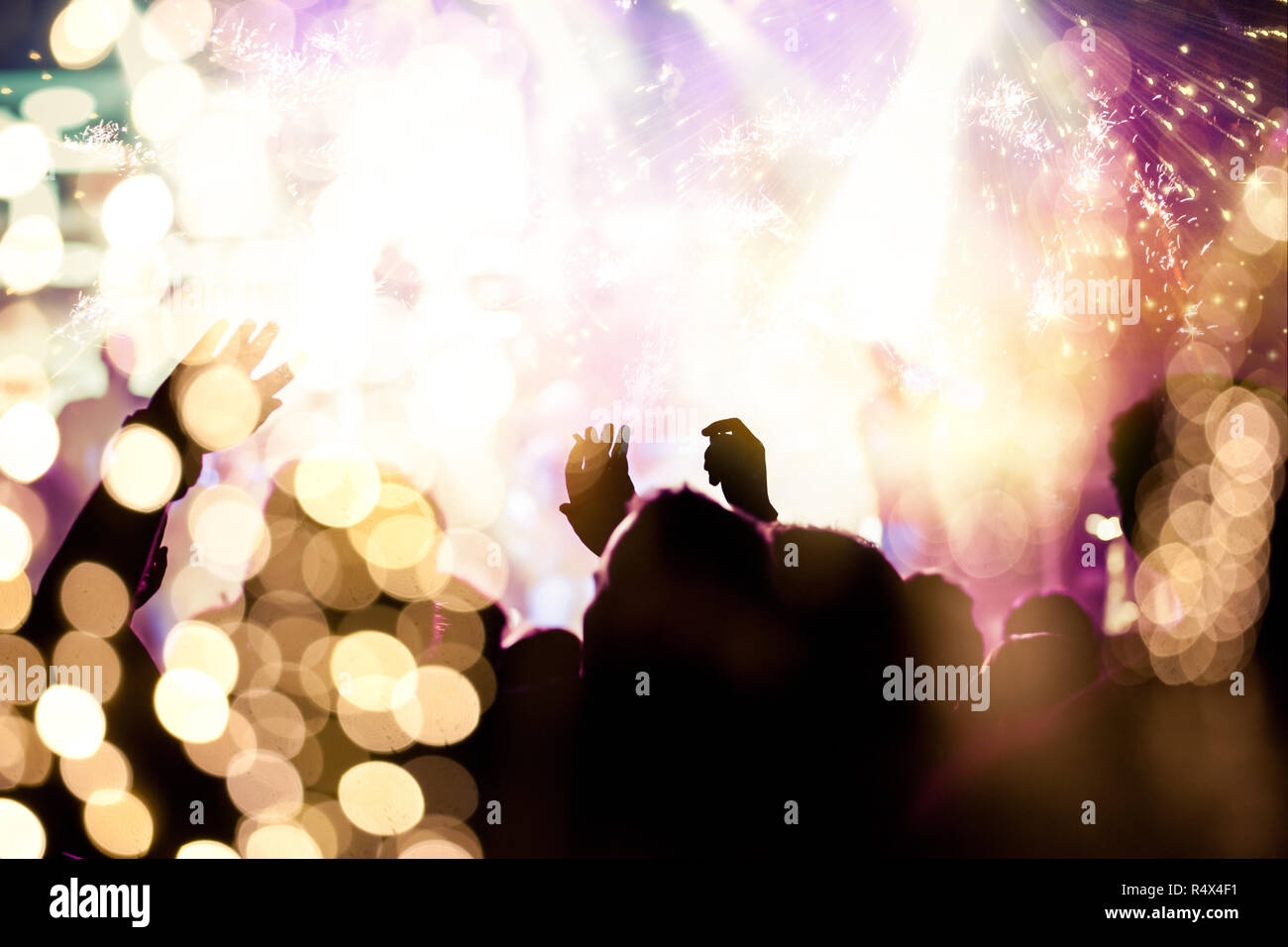new Year concept - cheering crowd and fireworks Stock Photo - Alamy