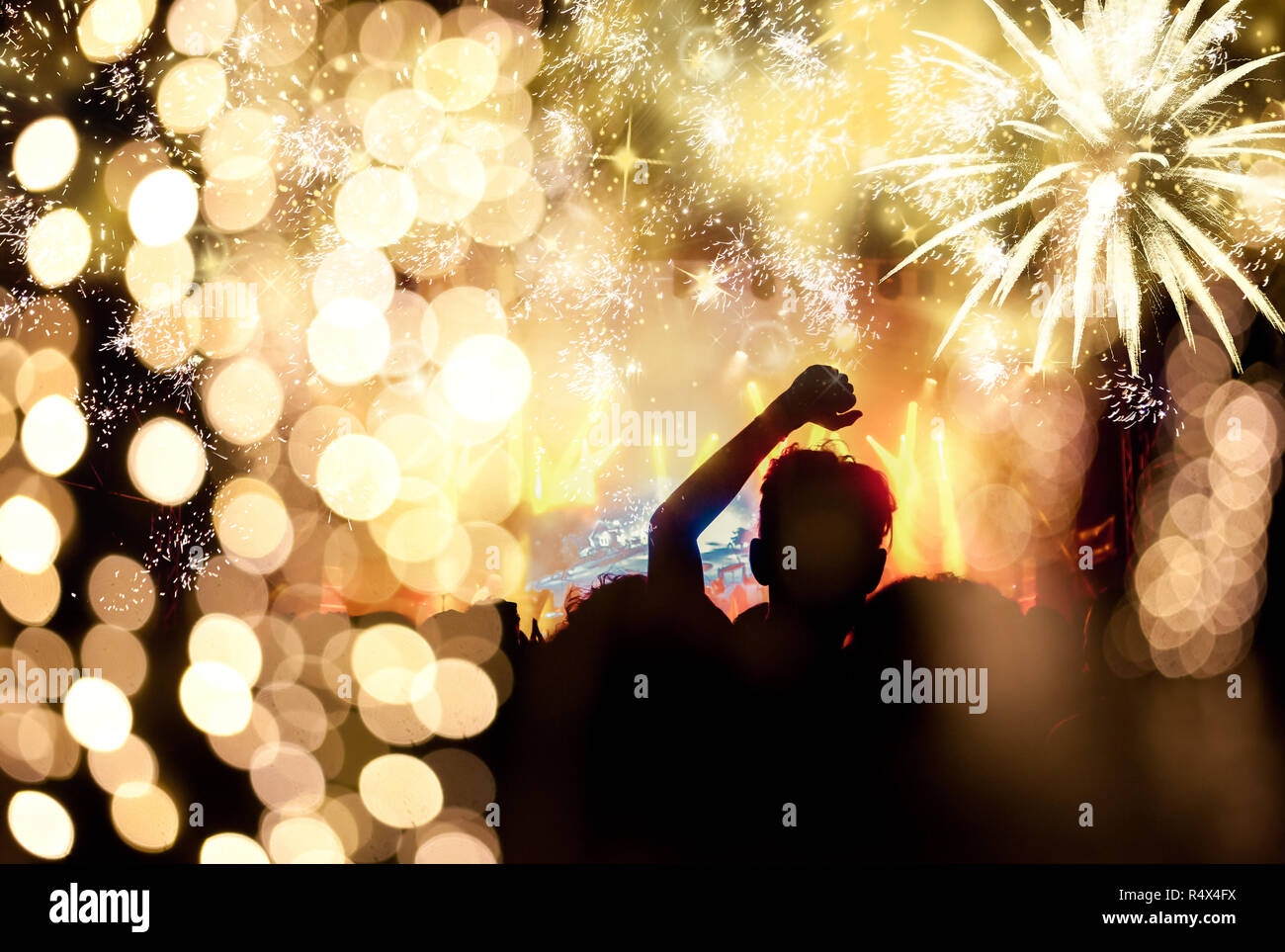 new Year concept - cheering crowd and fireworks Stock Photo - Alamy