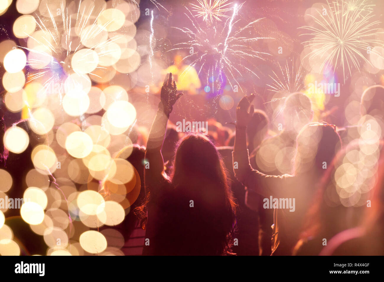 new Year concept - cheering crowd and fireworks Stock Photo - Alamy