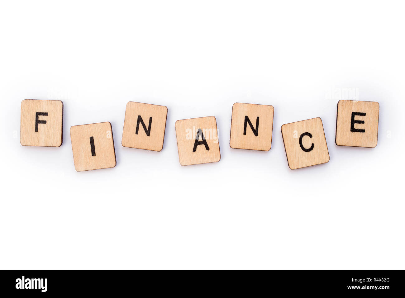 The word FINANCE spelt with wooden letter tiles Stock Photo - Alamy