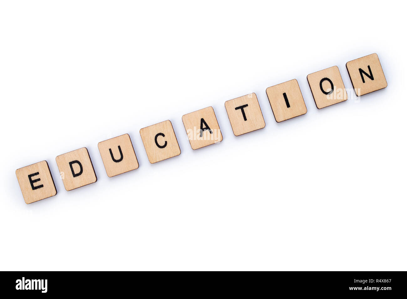The word EDUCATION, spelt with wooden letter tiles Stock Photo - Alamy