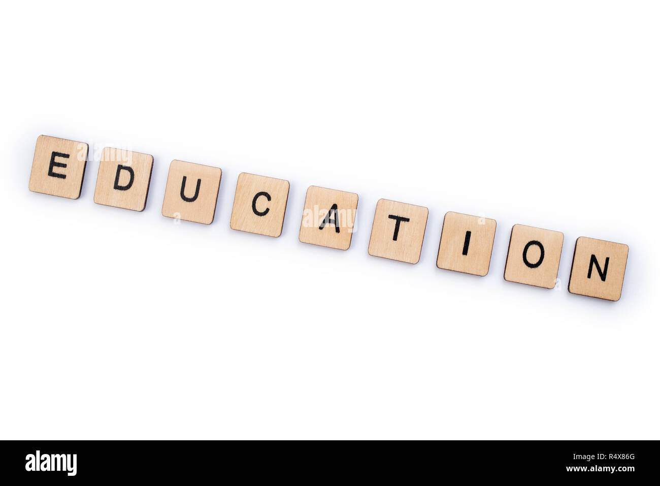 The word EDUCATION, spelt with wooden letter tiles Stock Photo - Alamy