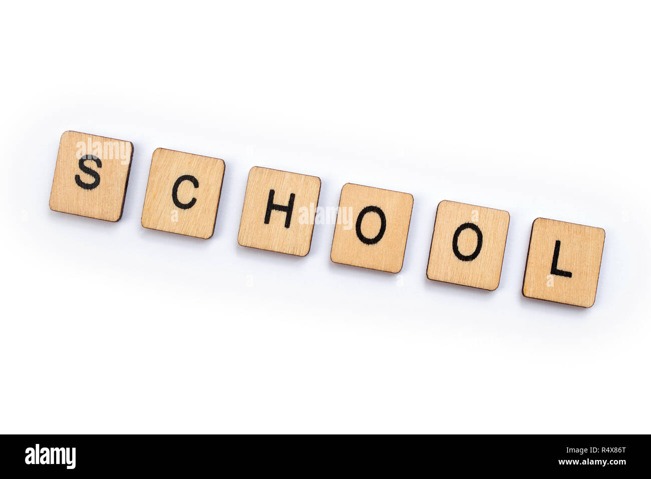 The word SCHOOL, spelt with wooden letter tiles Stock Photo - Alamy