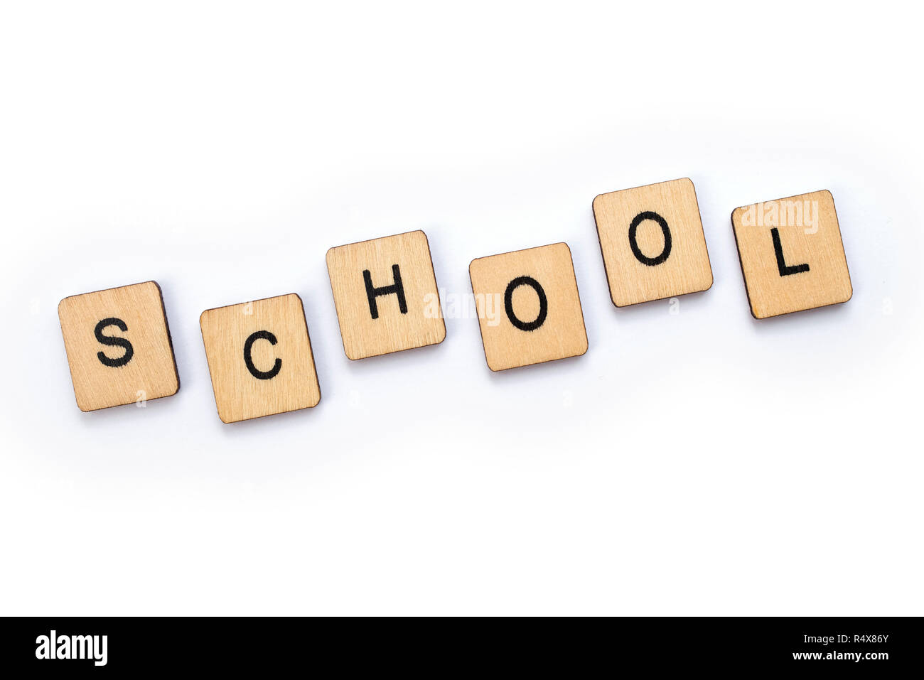 The word SCHOOL, spelt with wooden letter tiles Stock Photo - Alamy