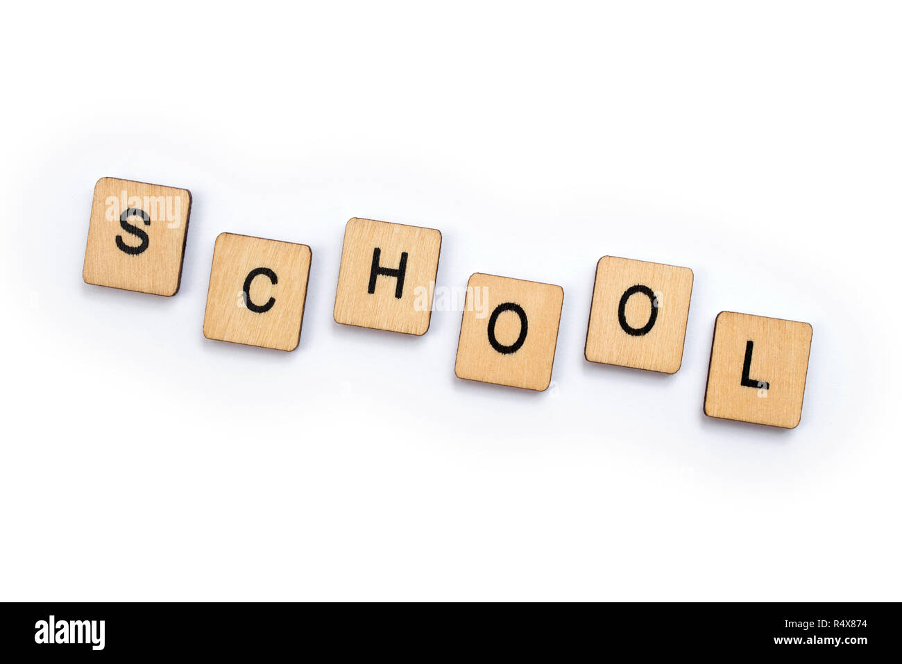 The word SCHOOL, spelt with wooden letter tiles Stock Photo - Alamy