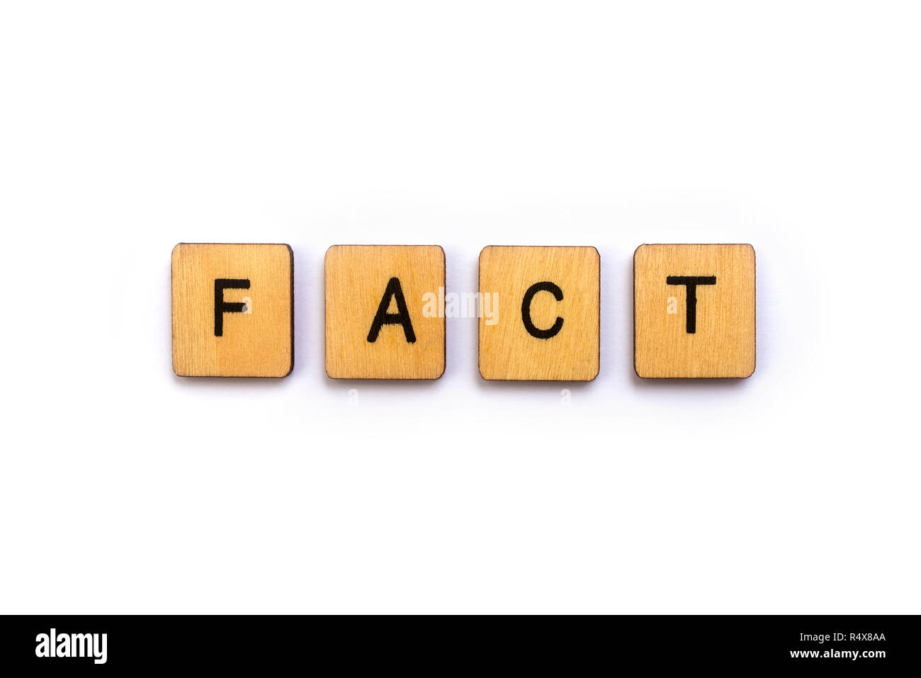 The word FACT, spelt with wooden letter tiles Stock Photo - Alamy