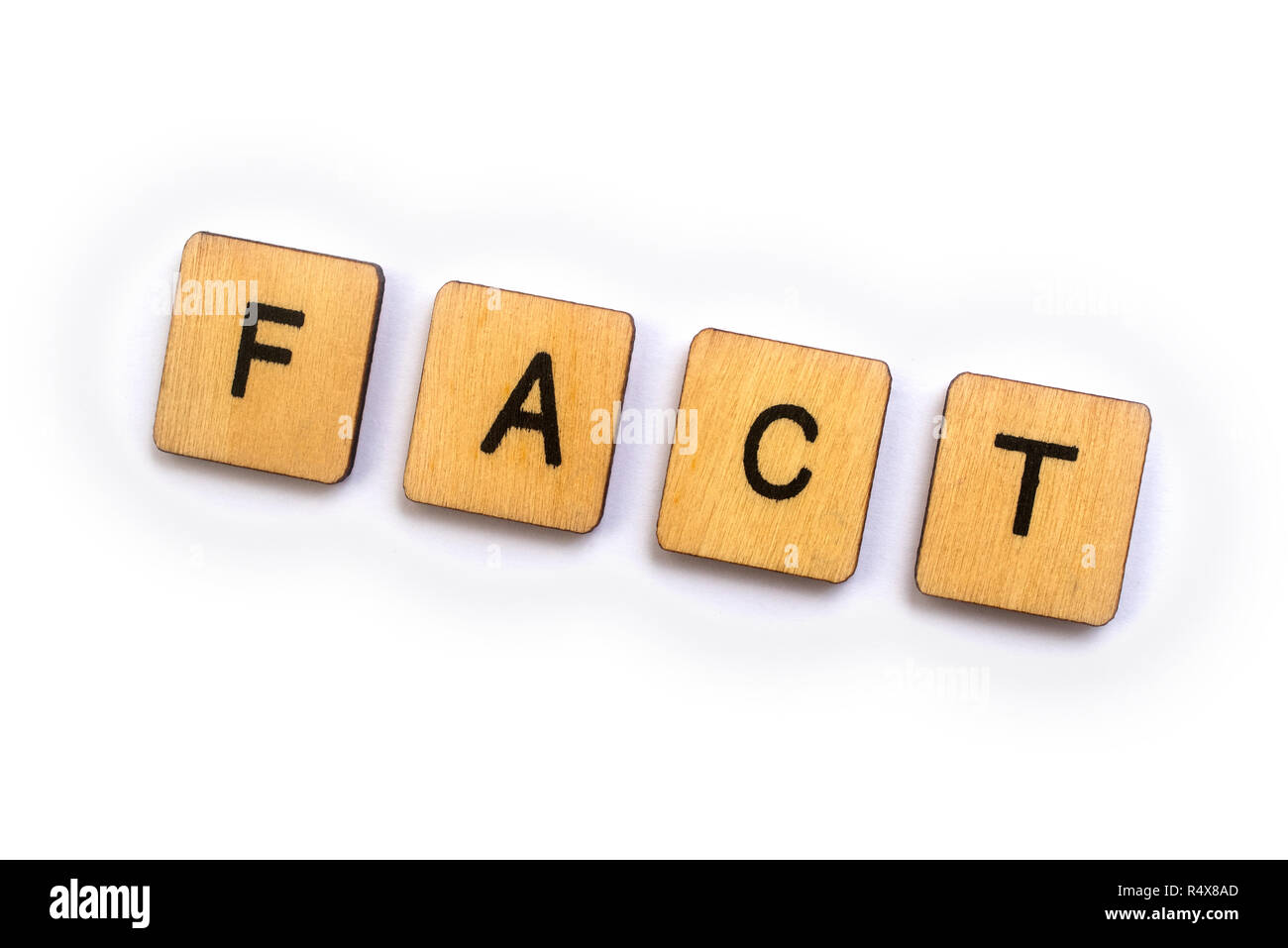 The word FACT, spelt with wooden letter tiles Stock Photo - Alamy