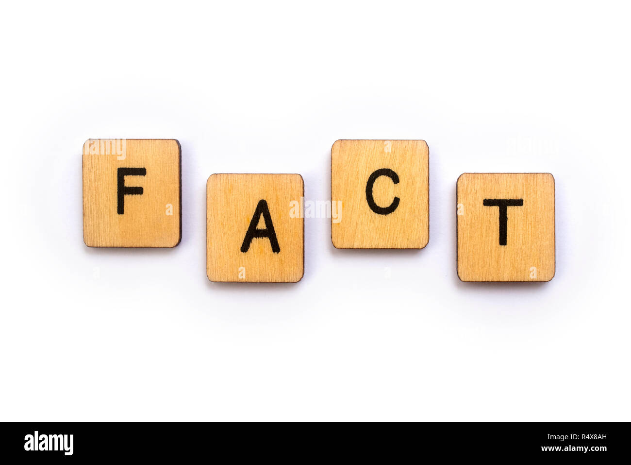 The word FACT, spelt with wooden letter tiles Stock Photo - Alamy