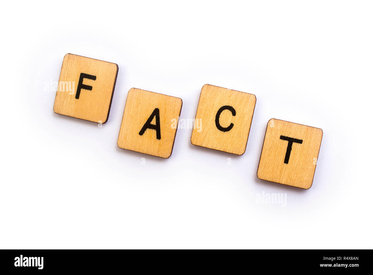 The word FACT, spelt with wooden letter tiles Stock Photo - Alamy