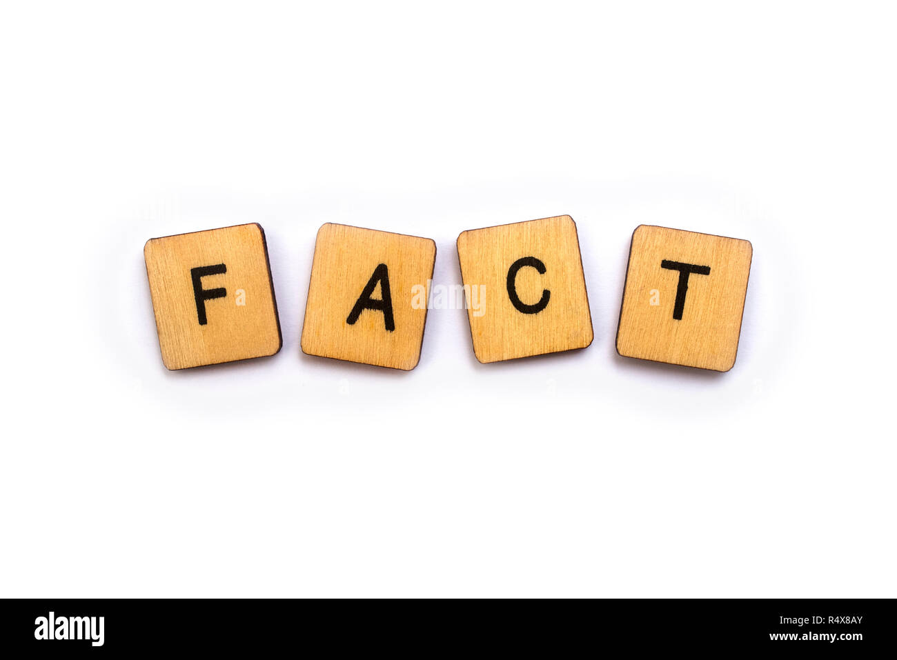 The word FACT, spelt with wooden letter tiles Stock Photo - Alamy