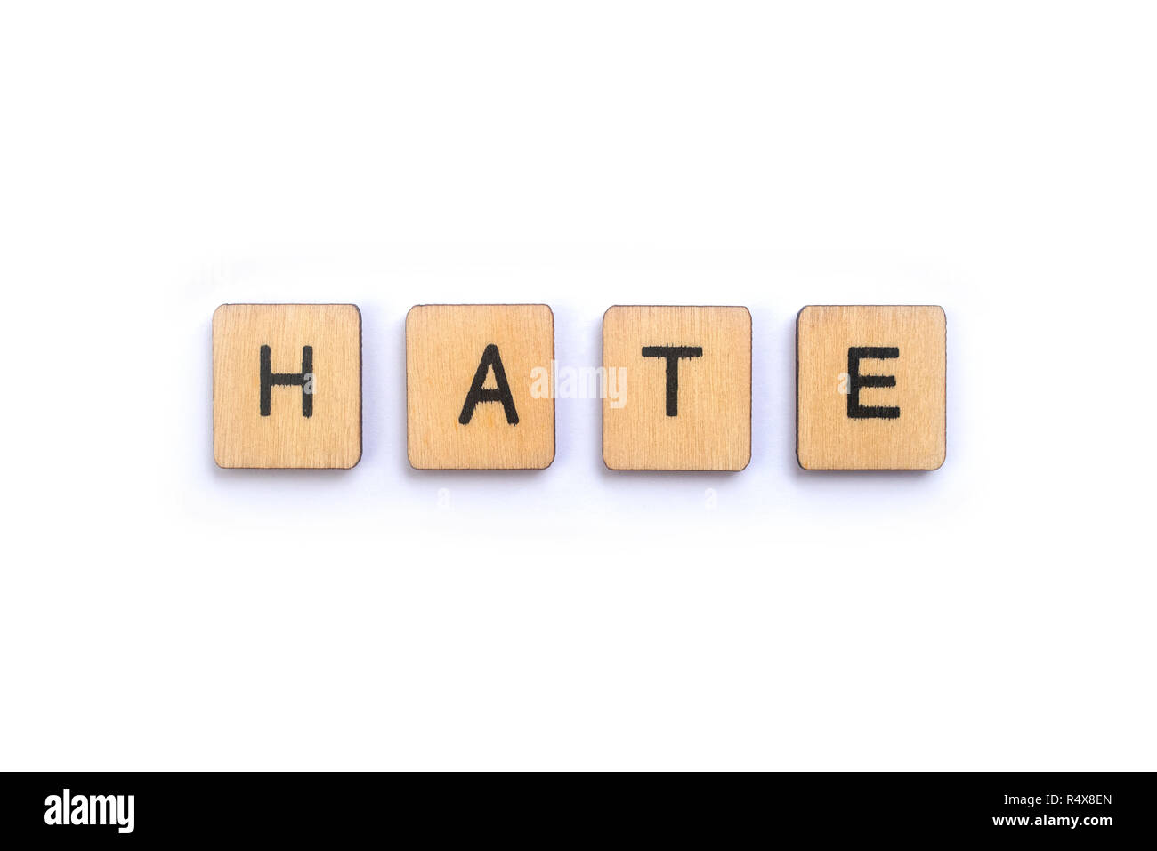 The word HATE, spelt with wooden letter tiles Stock Photo - Alamy