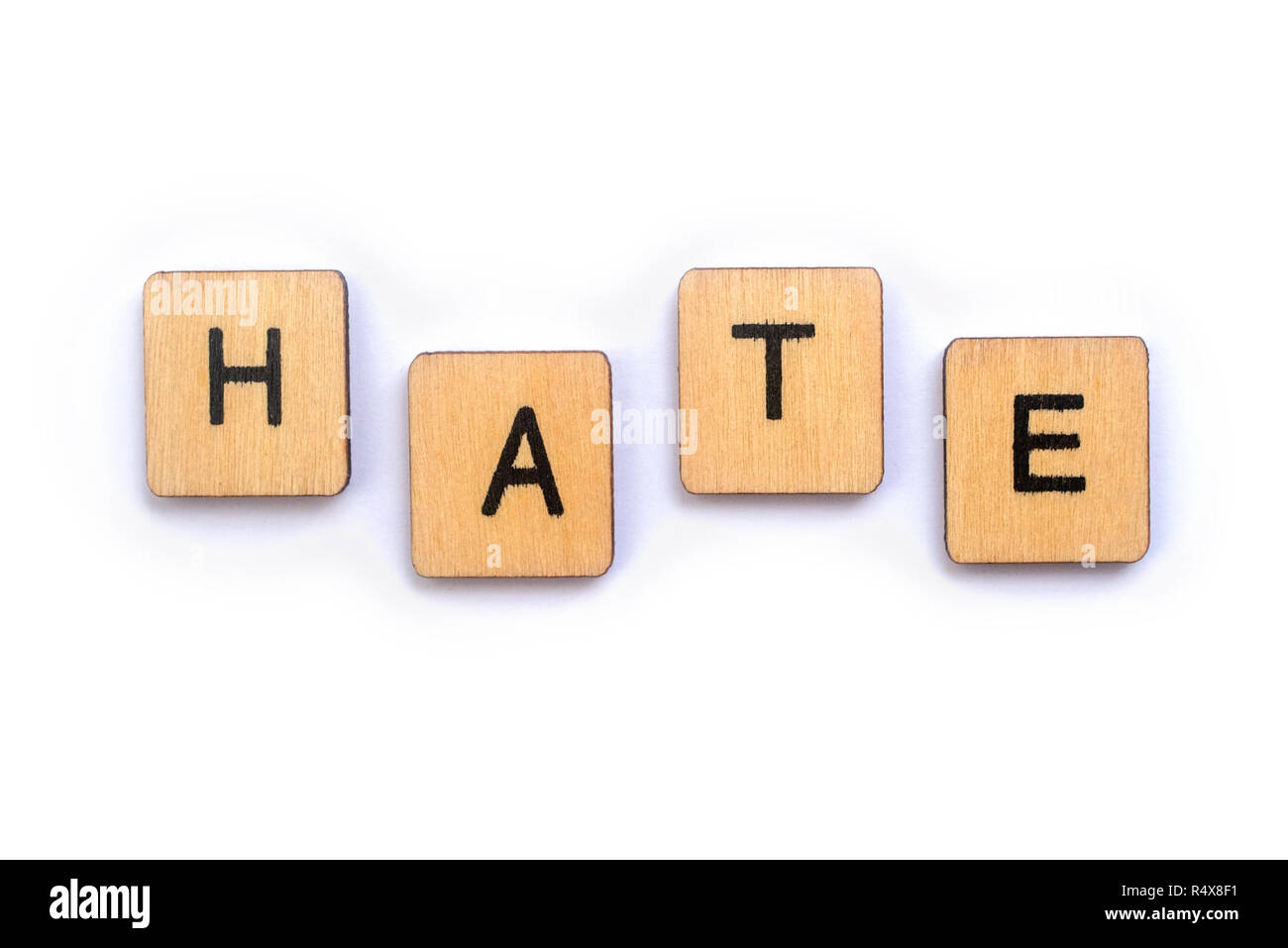 The word HATE, spelt with wooden letter tiles Stock Photo - Alamy
