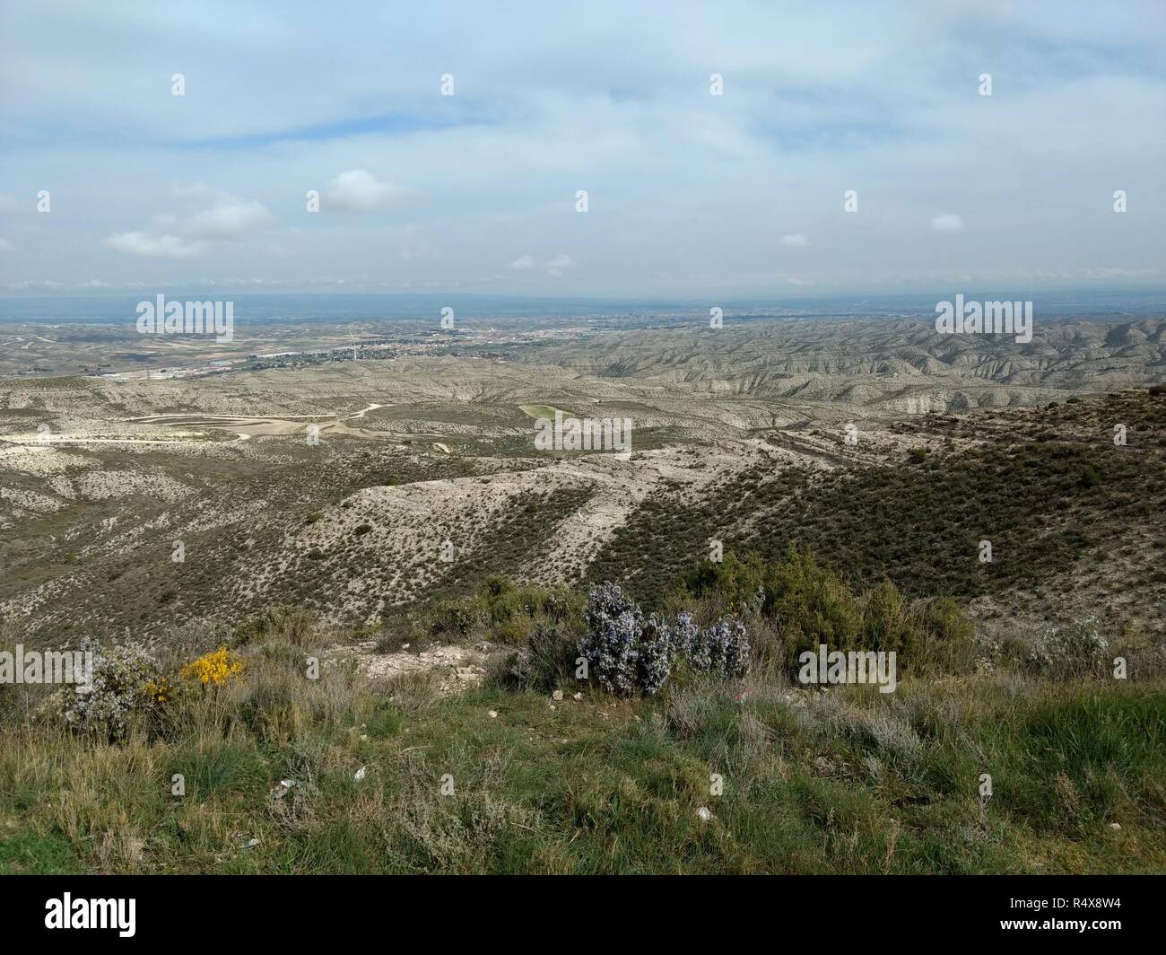 A typical rural landscape of Aragon region in Spain, with hills, grass ...
