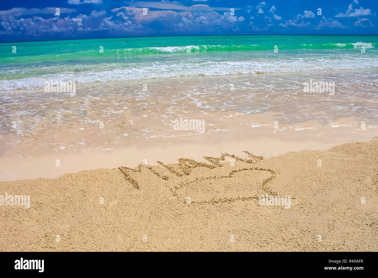 Tropical beach in Miami with bright blue sky, turquoise water and Miami ...