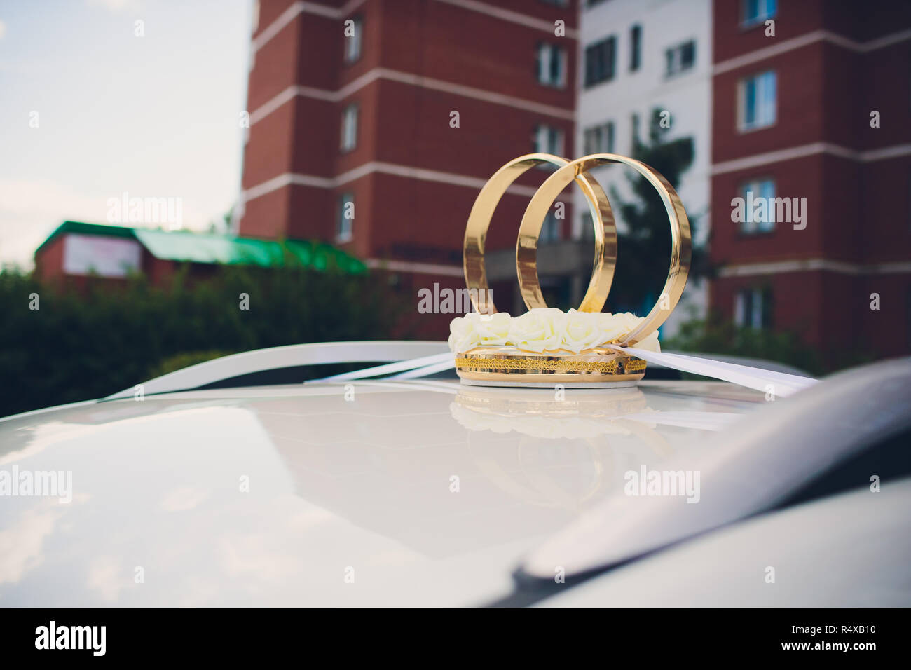 White wedding car decorated with flowers and rings Stock Photo - Alamy
