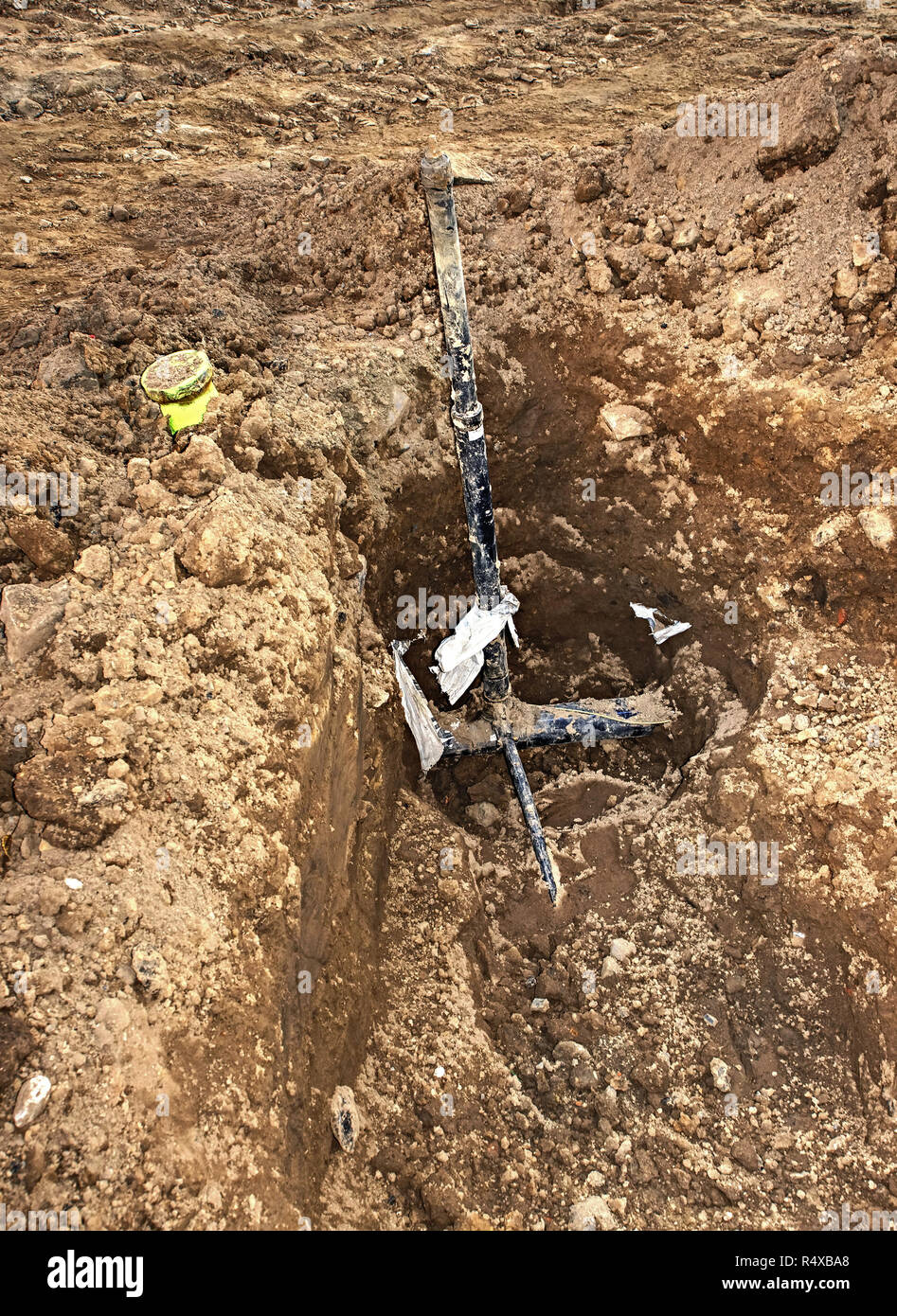 Installing district potable water pipes with control valve in a trench ...