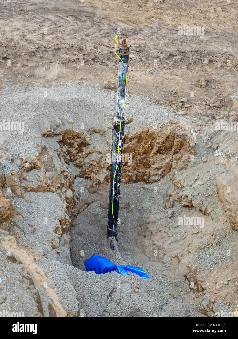 Building of new potable water tap in town street, maintenance work, dig ...