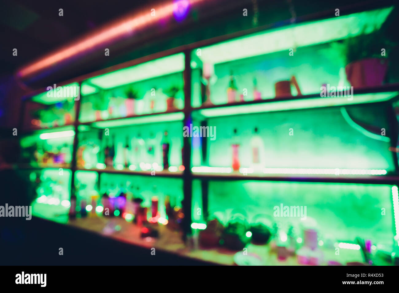 blur alcohol drink bottle at club pub or bar in dark party night ...