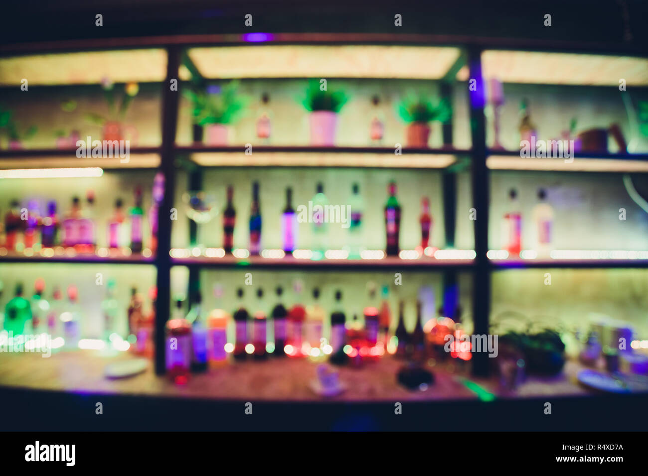 blur alcohol drink bottle at club pub or bar in dark party night ...