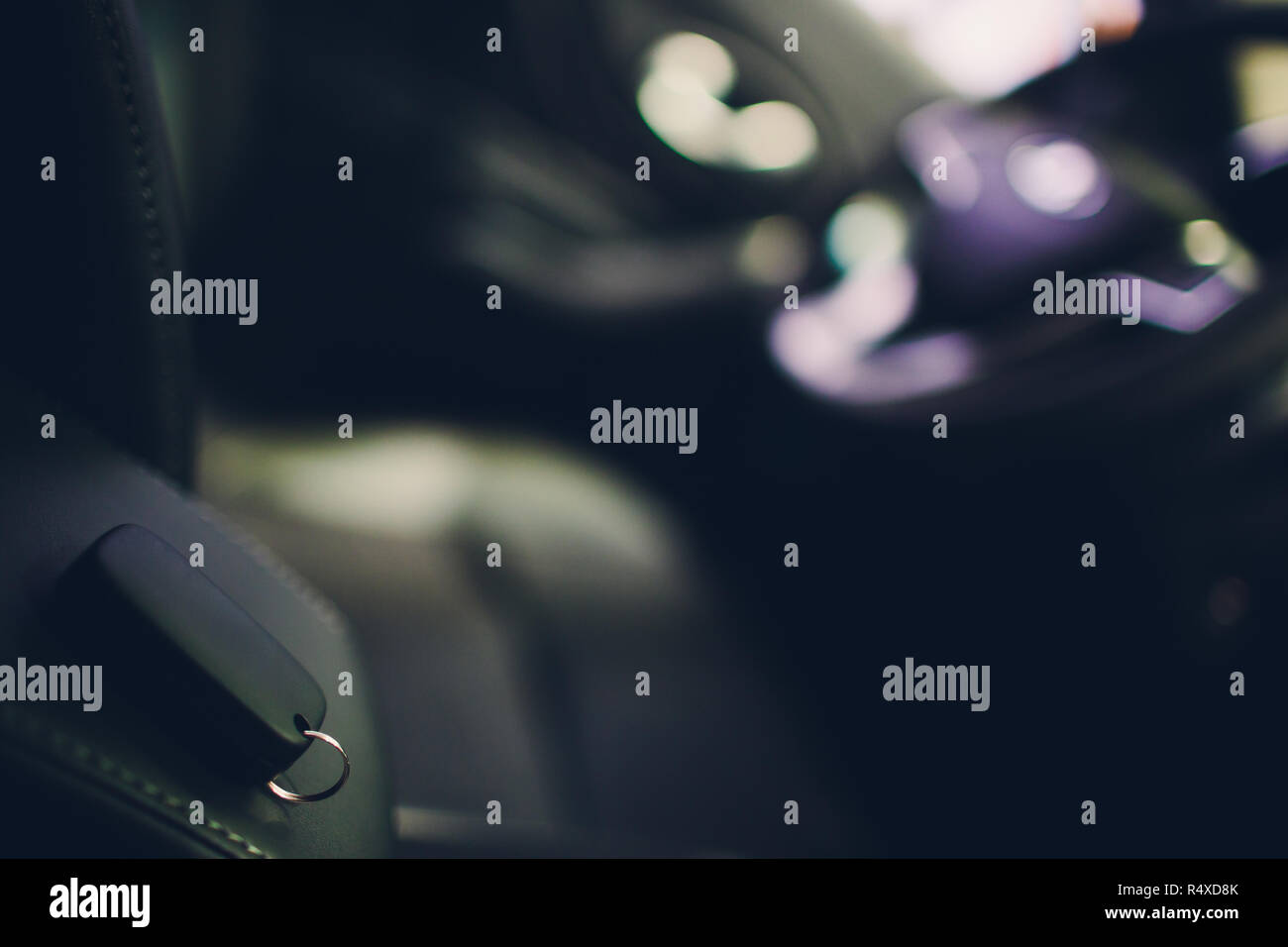 Closeup inside vehicle of wireless key ignition. Car key remote in ...