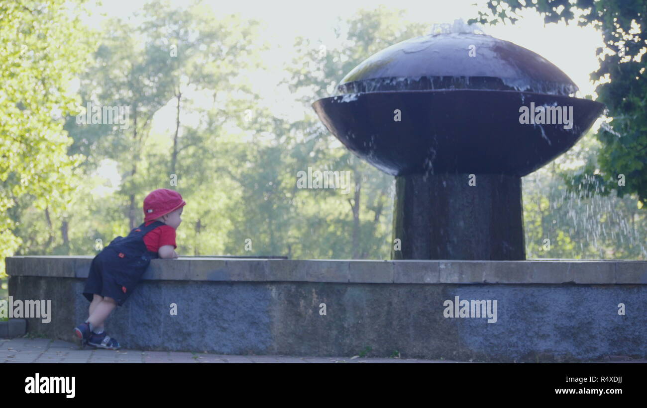 Child water fountain shadow hi-res stock photography and images - Alamy